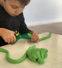 Scissor Skill Practice: Cutting Playdough - Playgroup WA